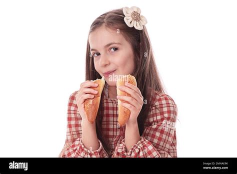 Happy Girl Eating Freshly Baked Homemade Bread Rolls With Seeds And
