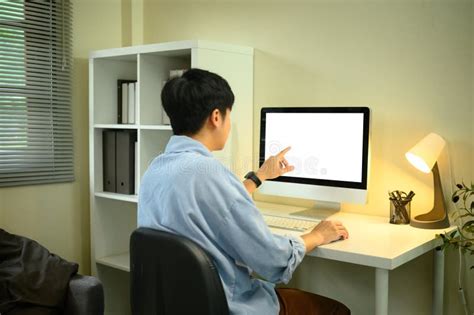 male user browsing or working on a large computer screen in a