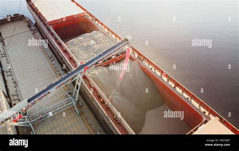 Grain Loading In Hold Of Bulk Carrier Ship With Elevator Crane Closeup Port Grain Elevator