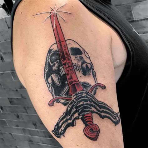 Skull And Sword Tattoo