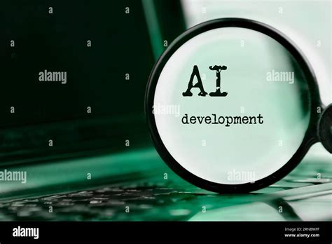 ai development technology demonstrated with laptop text and magnifying