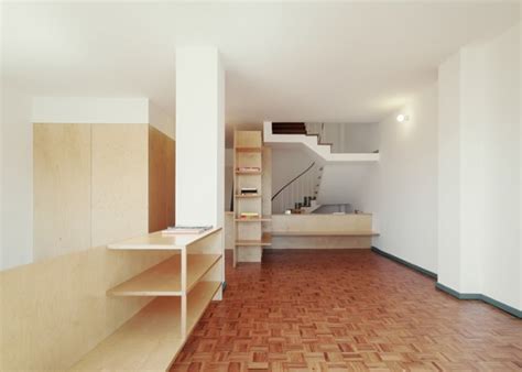 Wooden Structures Combine Partitions And Furniture In Portugal Home