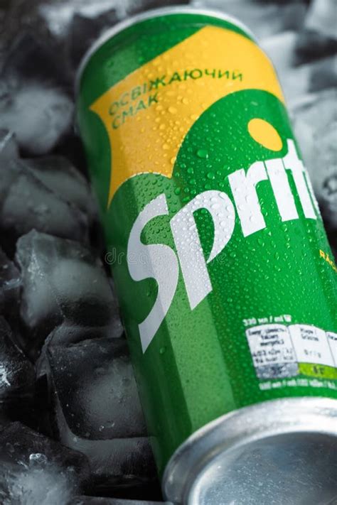 Close Up Shot Of Classic Sprite Can In The Pile Of Ice Cubes On The