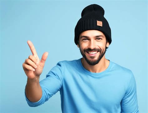Premium Psd Smiling Young Handsome Man Looking At Camera Showing Small Amount Sign Isolated On