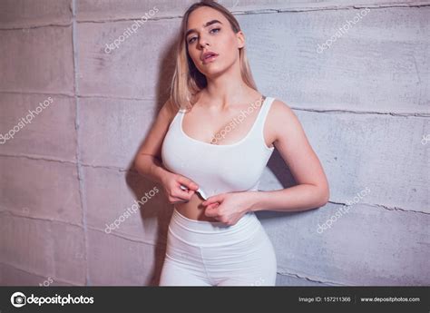 Sexy Blonde Woman With Huge Breast In A White Top And Leggings Mock Up