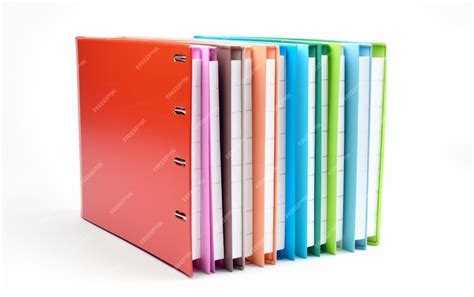 Premium Photo Row Of Different Colored Binders On White Background