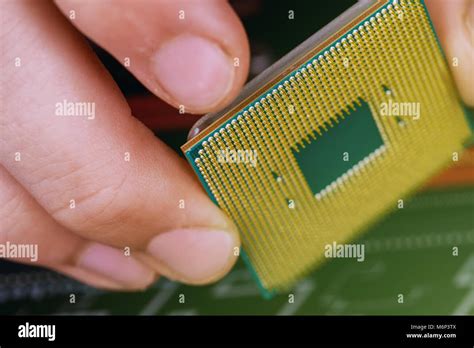 Computer Technician Installing CPU Into Motherboard Close Up Installed In PC Motherboard Stock