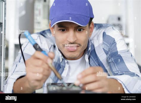 Man Testing Circuit Board In His Office Stock Photo Alamy