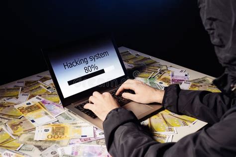 Anonymous Hacker Programmer Uses A Laptop To Hack The System In The