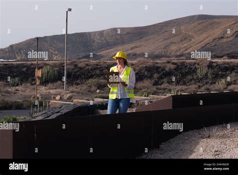 Woman Testing The Operation Of Solar Panels Stock Photo Alamy