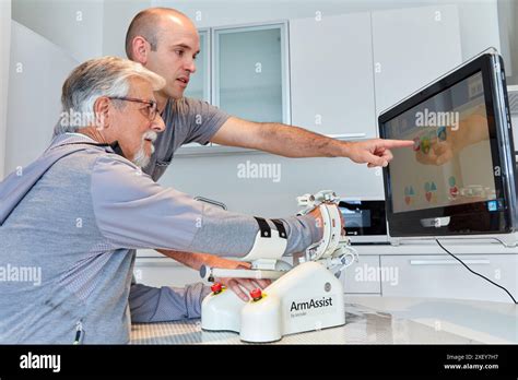 Patient With Assistive Robot For Upper Limb Rehabilitation The Robot Armassist Allows Passive