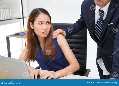 Angry Unhappy Asian Secretary Woman Looking Hand`s Boss Touching Her