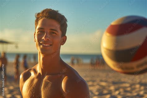 Male Beach Volleyball Players Play A Volleyball Match On The Beach
