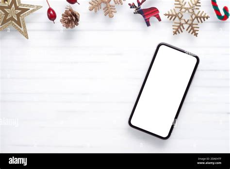 Mockup Blank White Screen Smartphone On White Desk Background For