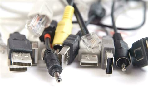 A Hand Holding Several Different Types Of Cables 27094480 Stock Photo At Vecteezy
