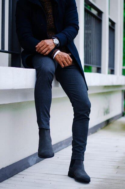 Premium Photo Low Section Of Man Sitting At Window