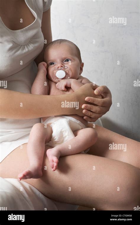 A Mother Holding Her Newborn Baby Stock Photo Alamy