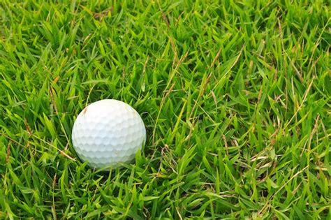Premium Photo Golf Ball On Grass