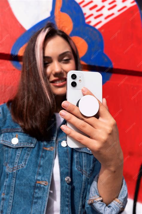 Free Photo Medium Shot Young Woman Using Popsocket