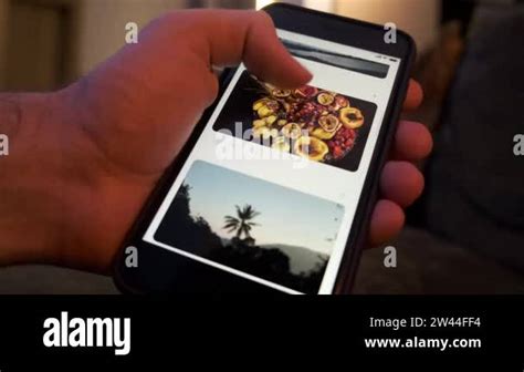 Man Using Smartphone Scrolling Through Social Network Feed Doing Swiping Scrolling Gestures