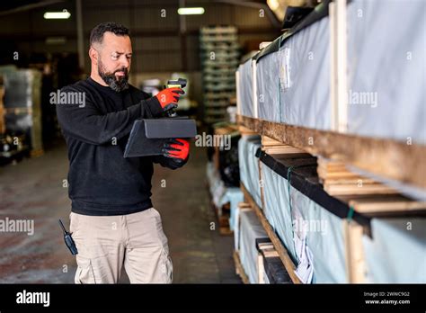 Mature Dispatcher Using Tablet PC And Scanning Bar Codes Stock Photo Alamy