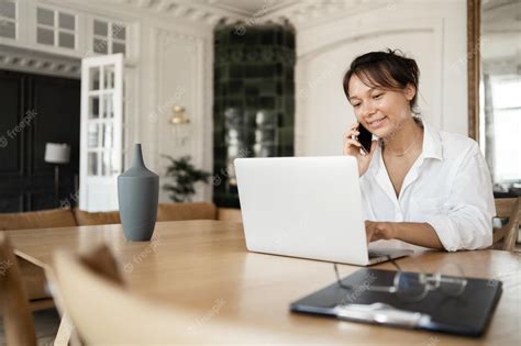 Premium Photo A Female Freelancer Works In An Office Online Doing A Design Project On A