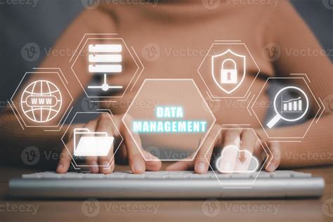 Data Management Concept Person Hand Typing On Keyboard With Data Management Icon On Virtual